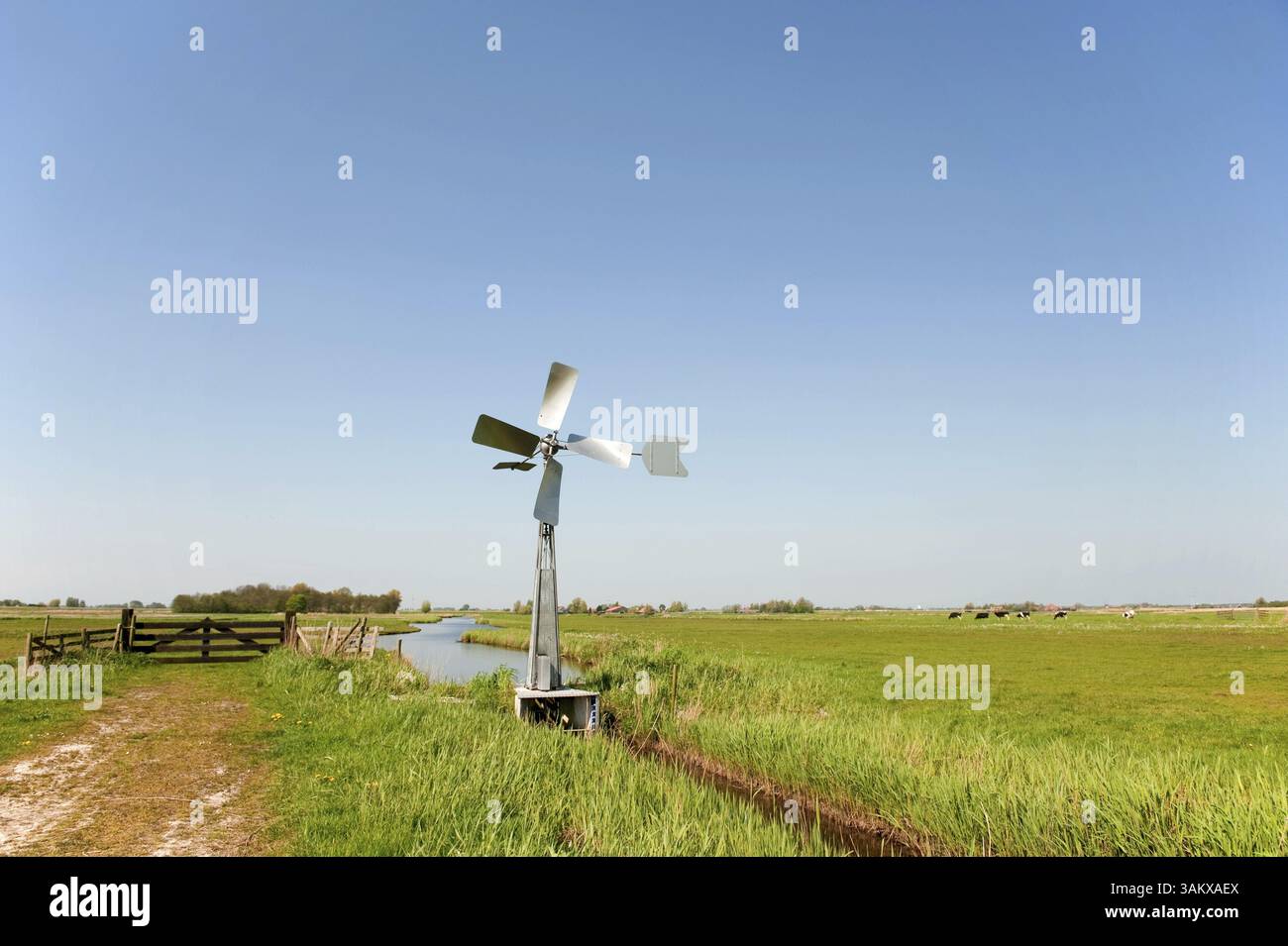 Watermill in vertical Dutch landscape with meadows and ditch Stock ...