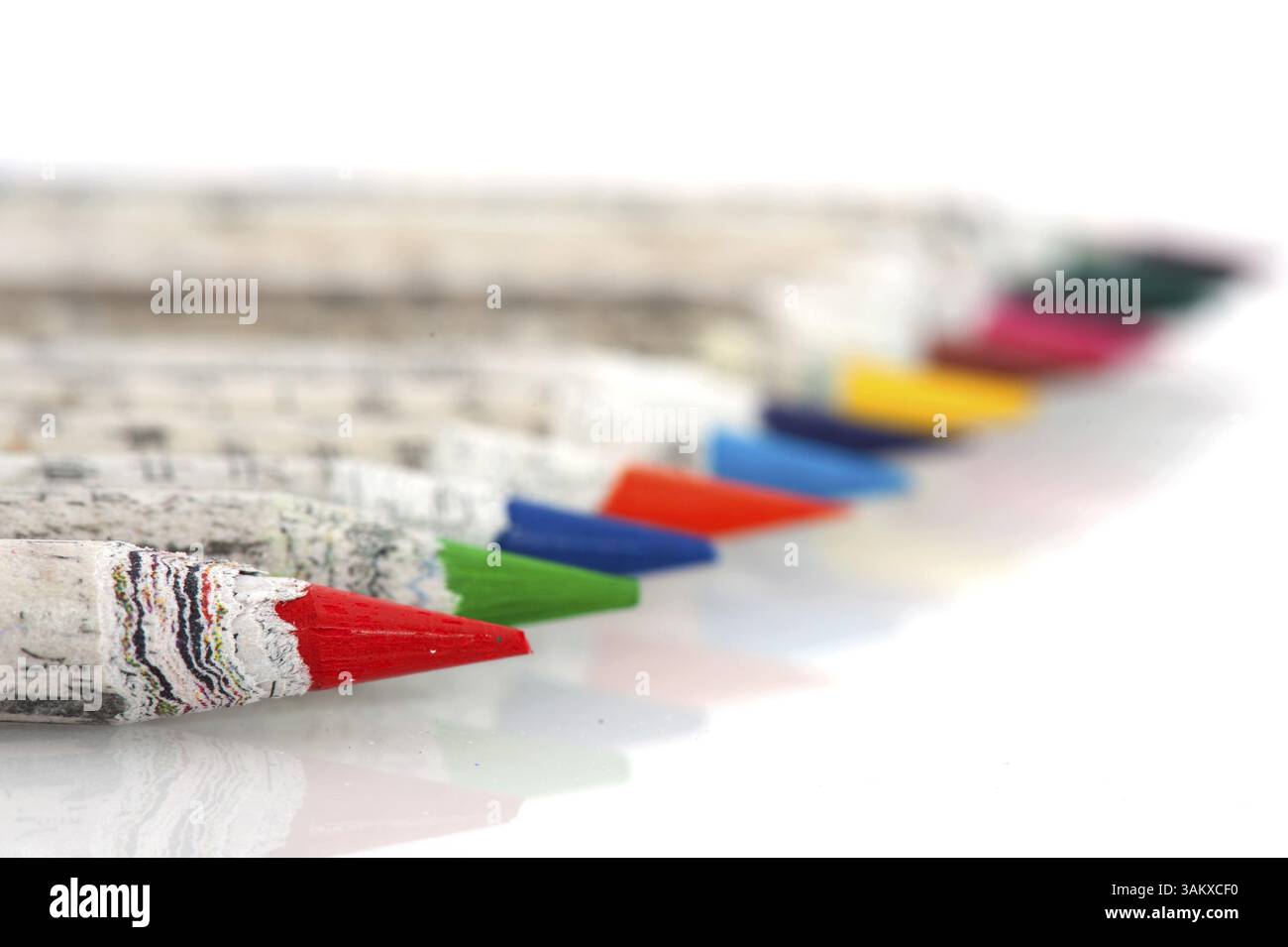Chinese color pencils made from newspapers in a row Stock Photo - Alamy