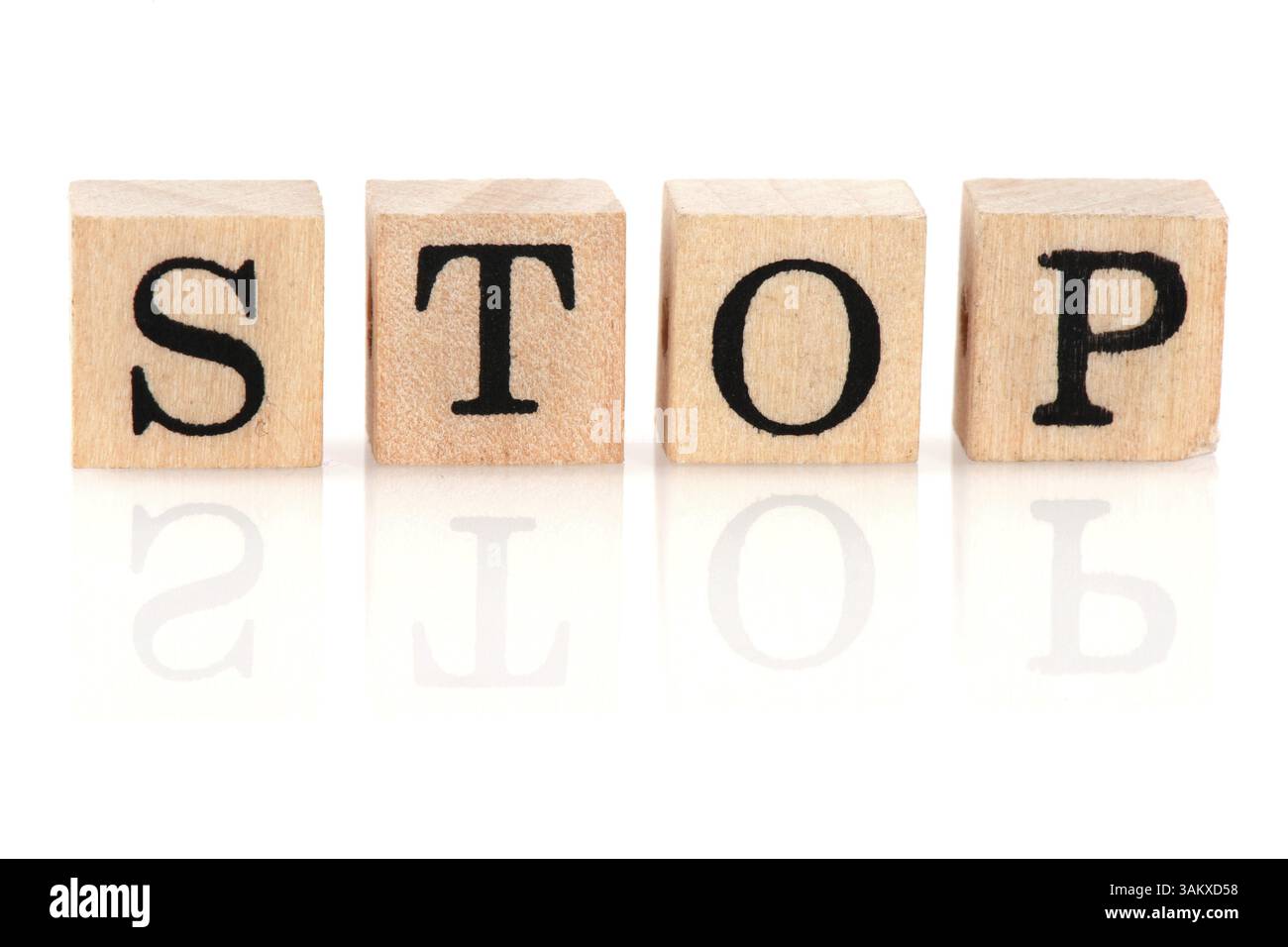 Stop text in wooden blocks with reflection Stock Photo - Alamy