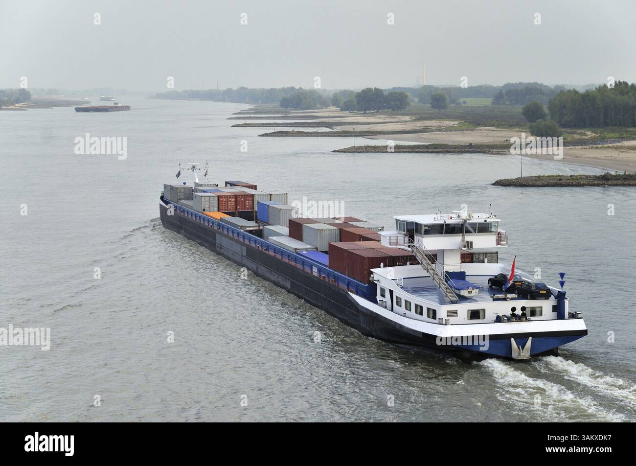 Big container ship at the river Stock Photo - Alamy