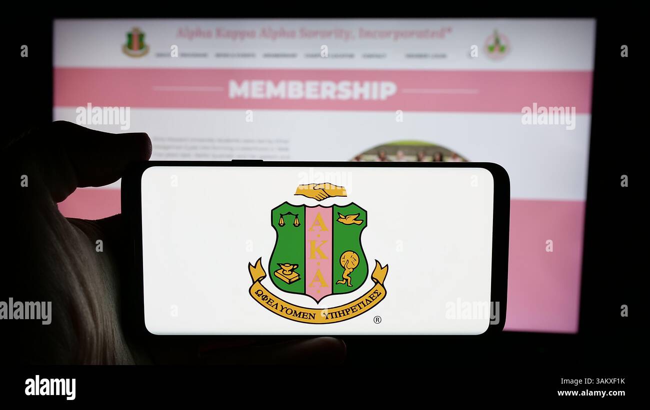 Stuttgart, Germany - 11-26-2024: Person holding cellphone with logo of ...