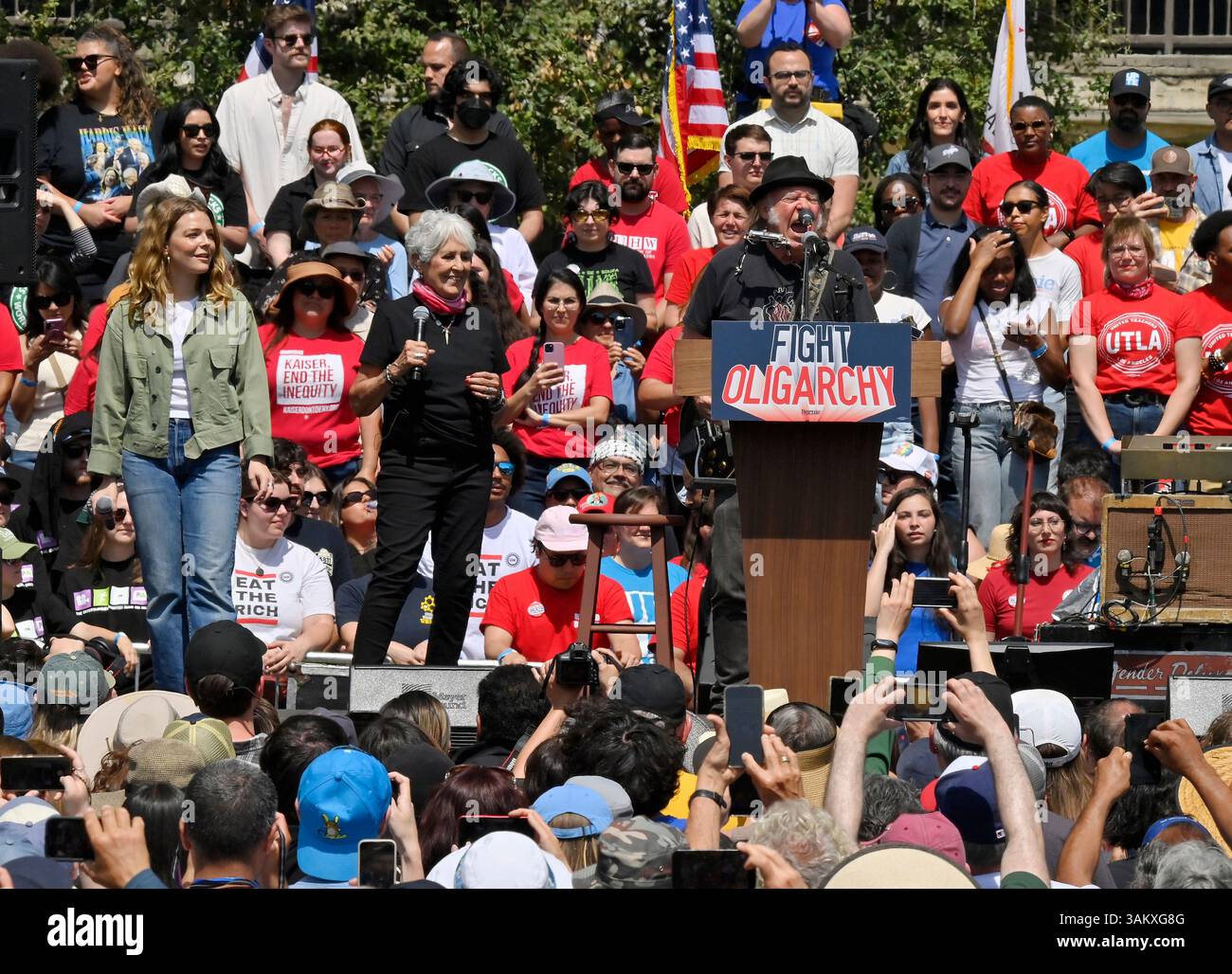Musicians Maggie Rogers, Joan Baez and Neil Young (L-R) perform before ...