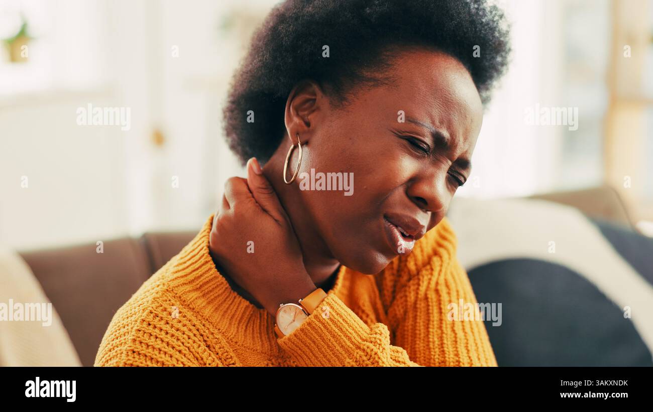 Black woman, discomfort and neck pain on couch at house of joint ...
