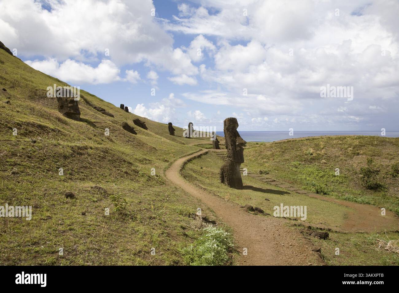 Several mysterious statues at easter island Stock Photo - Alamy