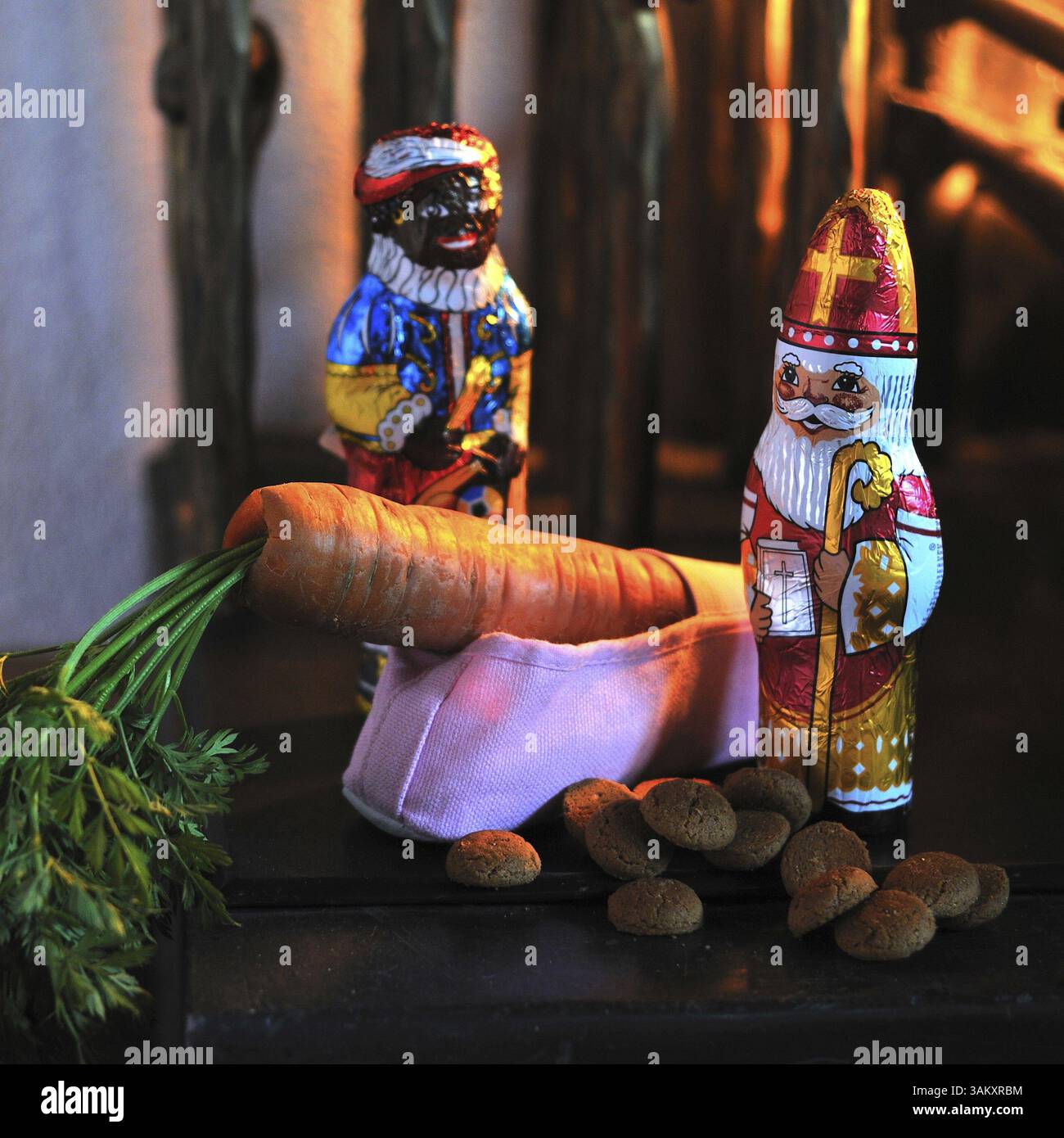 Sinterklaas and black piet by the filled shoe Stock Photo - Alamy