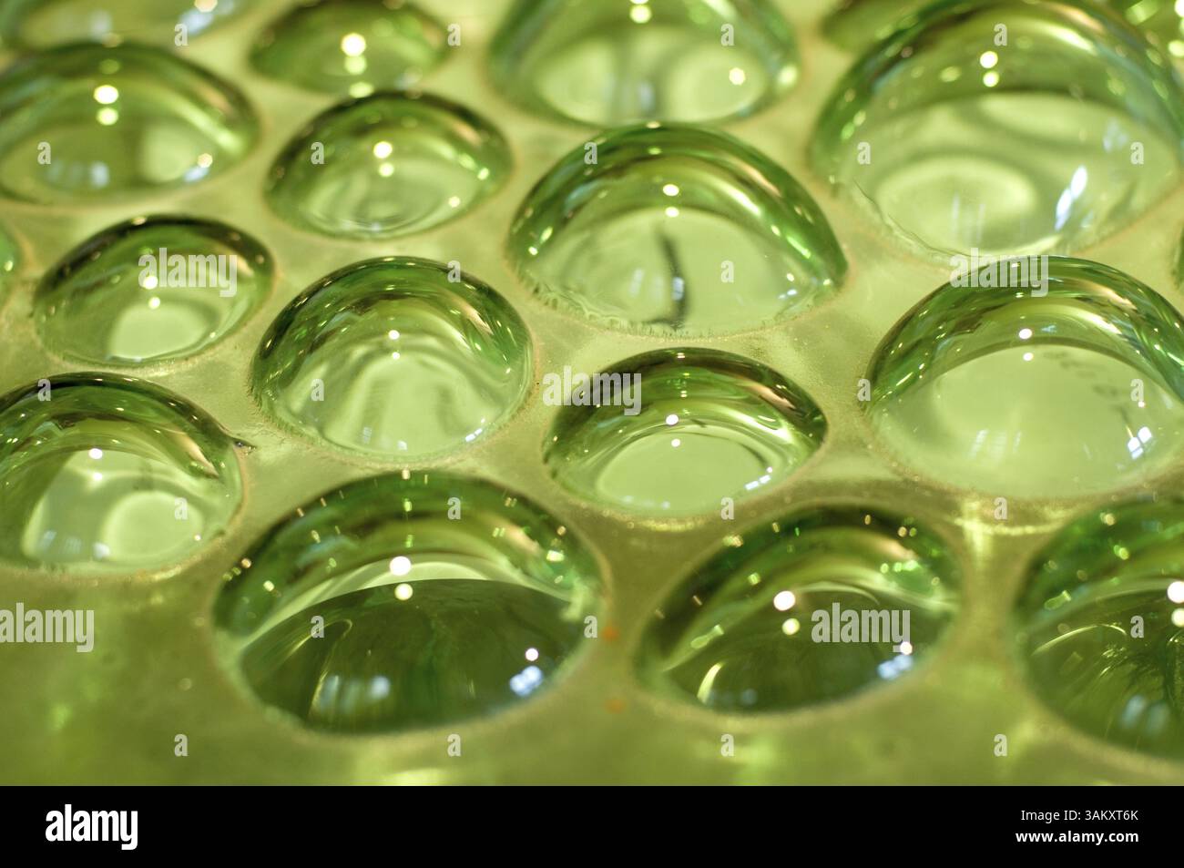 Green glass with relief Stock Photo - Alamy