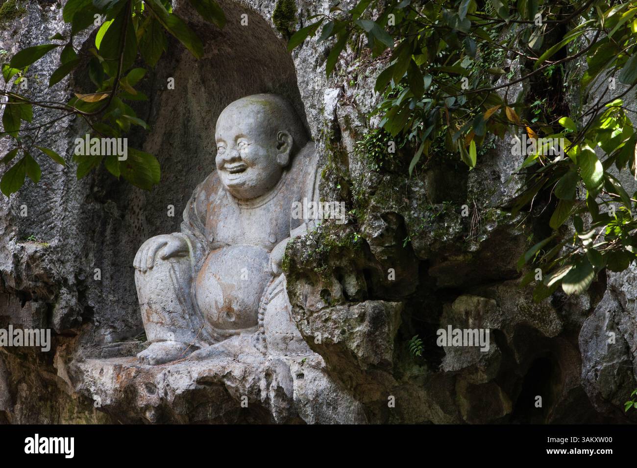 This photo captures the stone carving of Budai Monk on Feilai Peak in ...