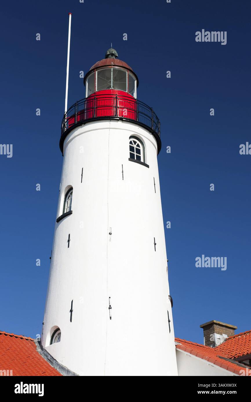 White lighthouse in little Dutch fishing village Urk Stock Photo - Alamy