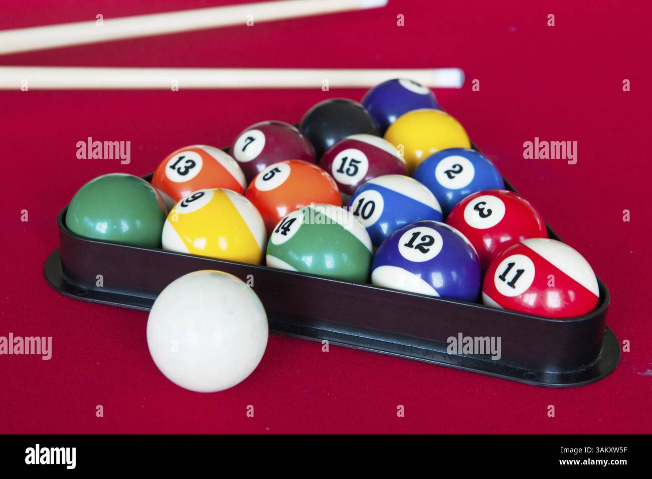Pool billiards on red table to play Stock Photo - Alamy