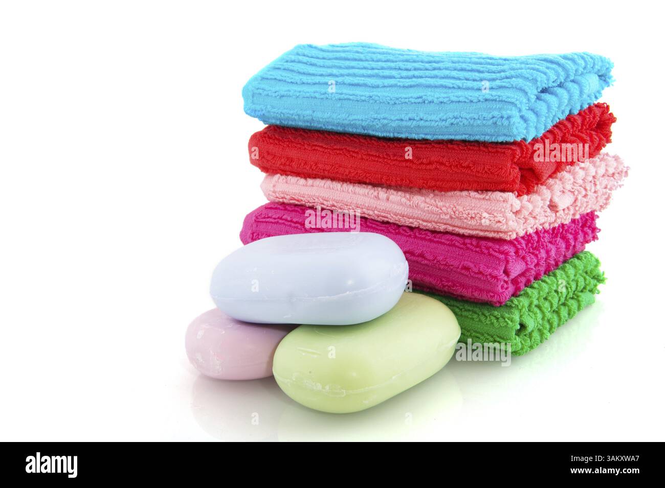 Colorful towels with pieces of soap Stock Photo - Alamy