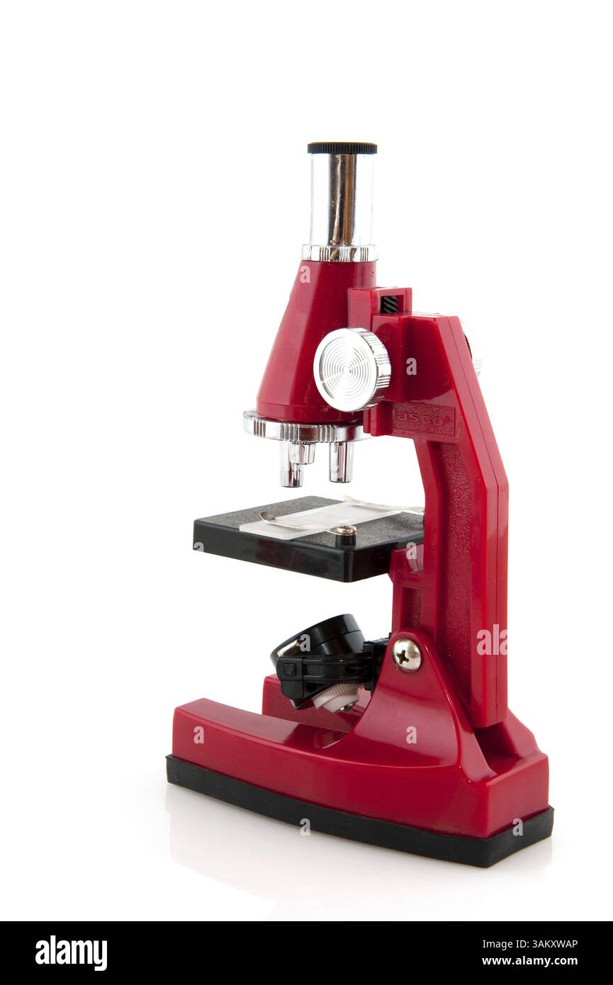 Red microscope with testing glass isolated over white Stock Photo - Alamy