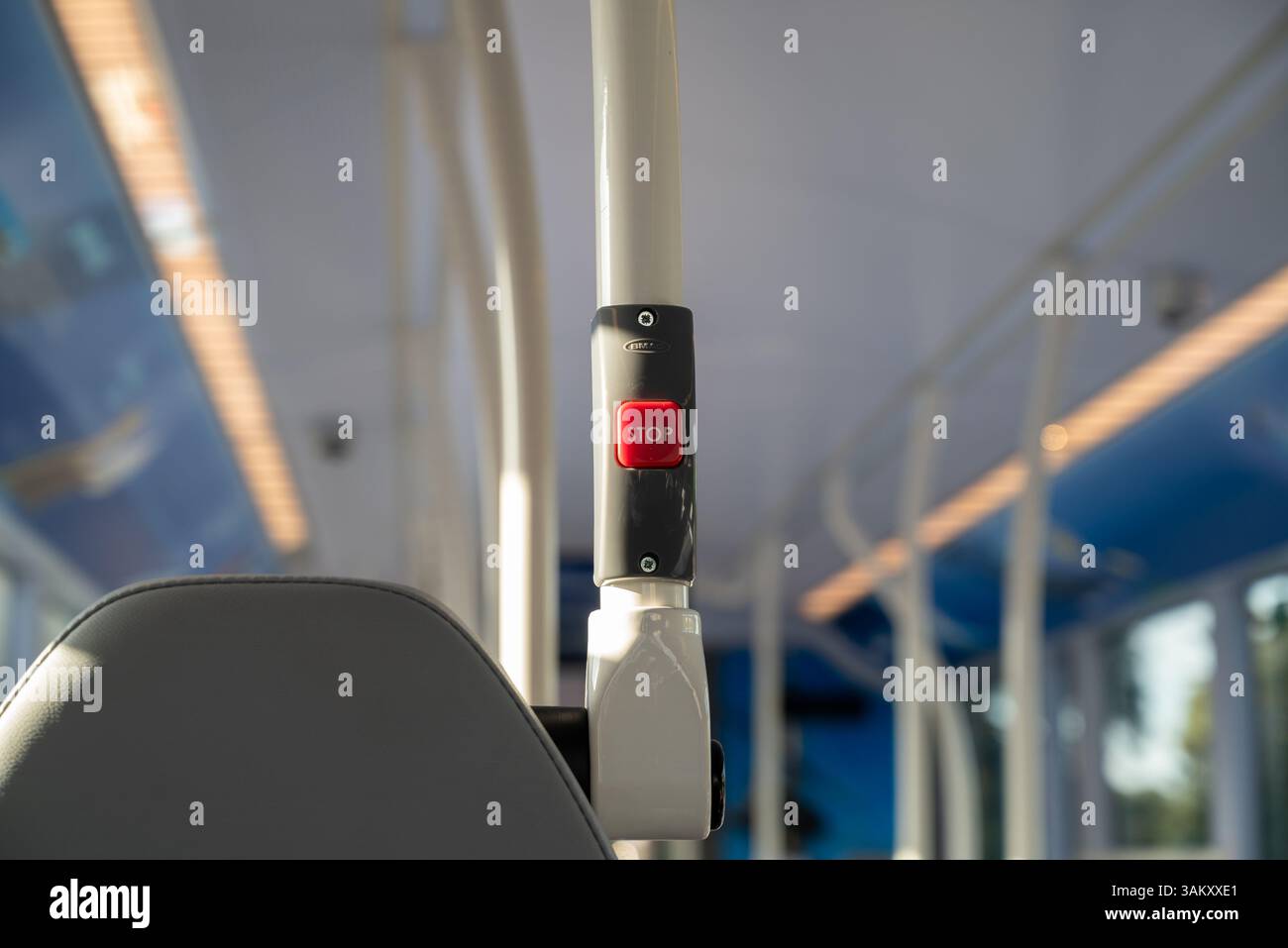 Red stop button on a public bus, press to tell the driver you want the ...