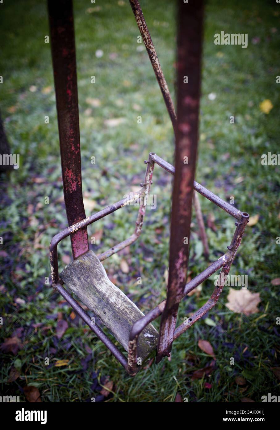 The broken child's swing. Unhappy childhood Stock Photo - Alamy