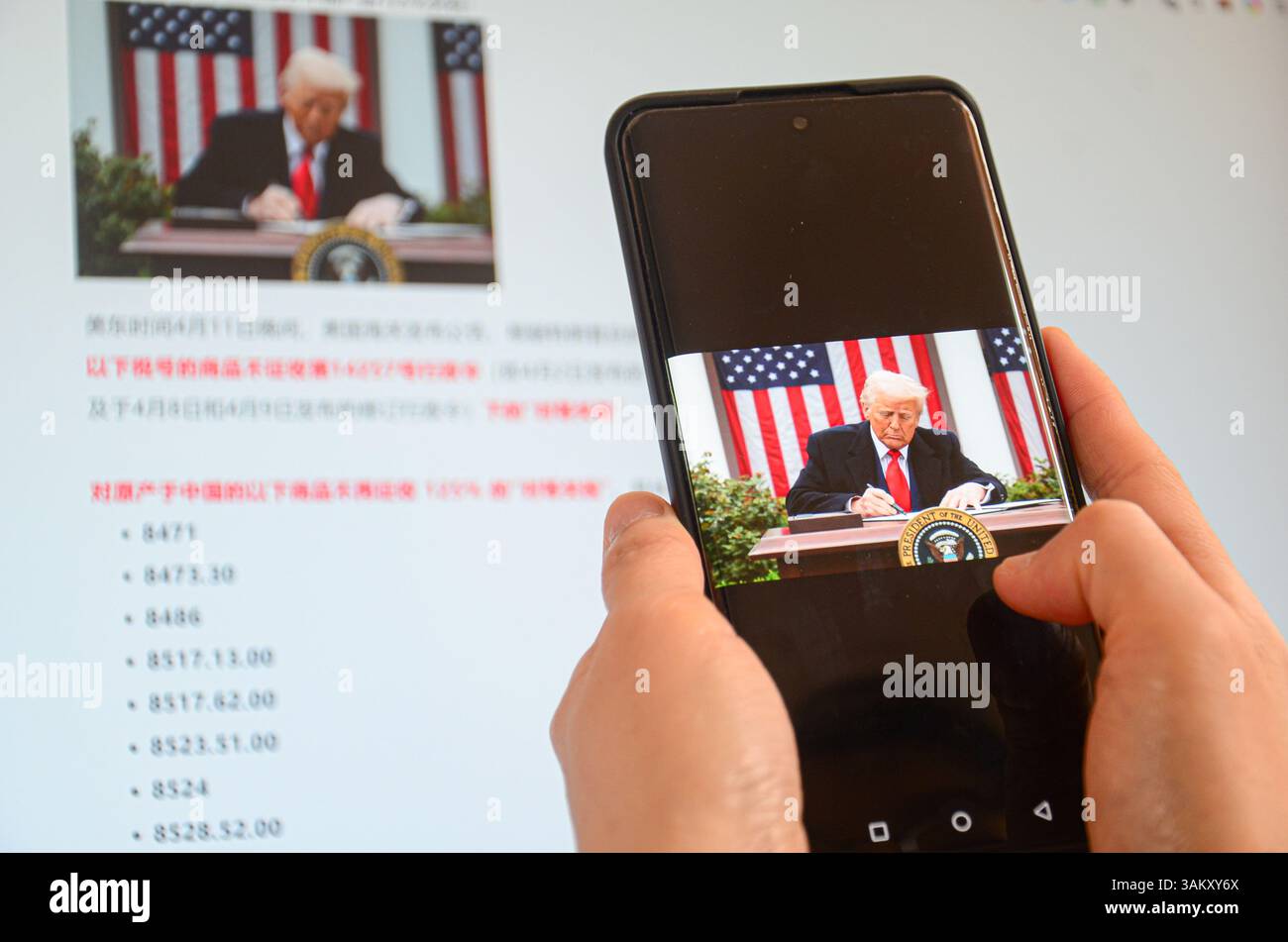 Jiangmen,Guangdong,China.13rd April,2025.Chinese people use smartphone ...