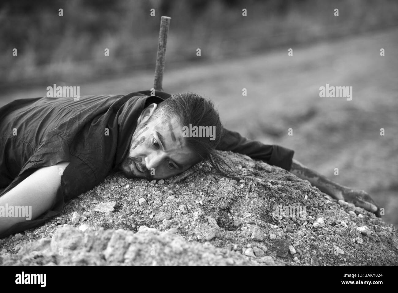 Murder. Dead zombie with a pale in his back Stock Photo - Alamy