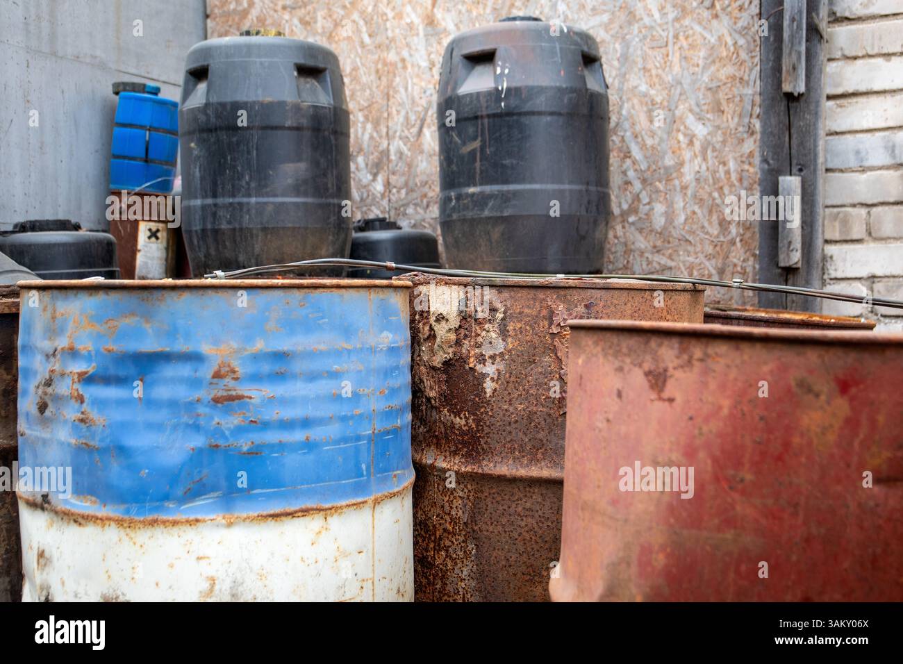 Rusty and Weathered Barrels in Industrial Storage Area Stock Photo - Alamy