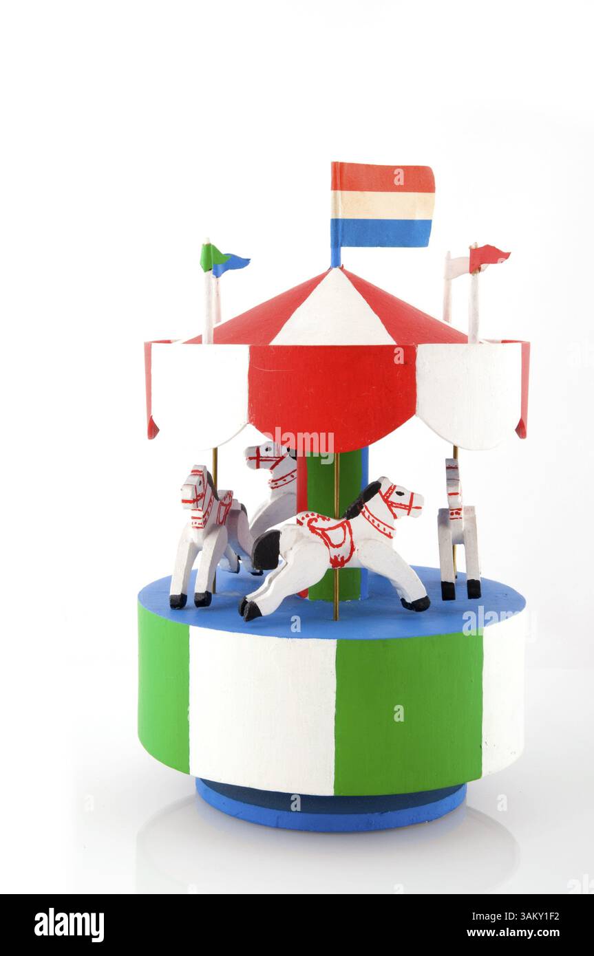 Merry-go-round with flags and horses Stock Photo - Alamy