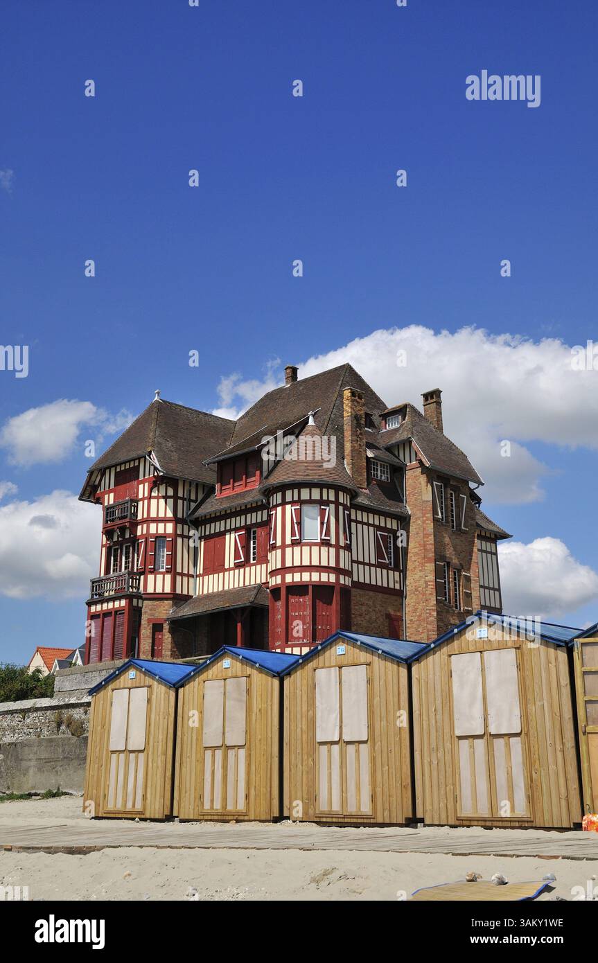 Beach huts in front of a typical Normandy house Stock Photo - Alamy