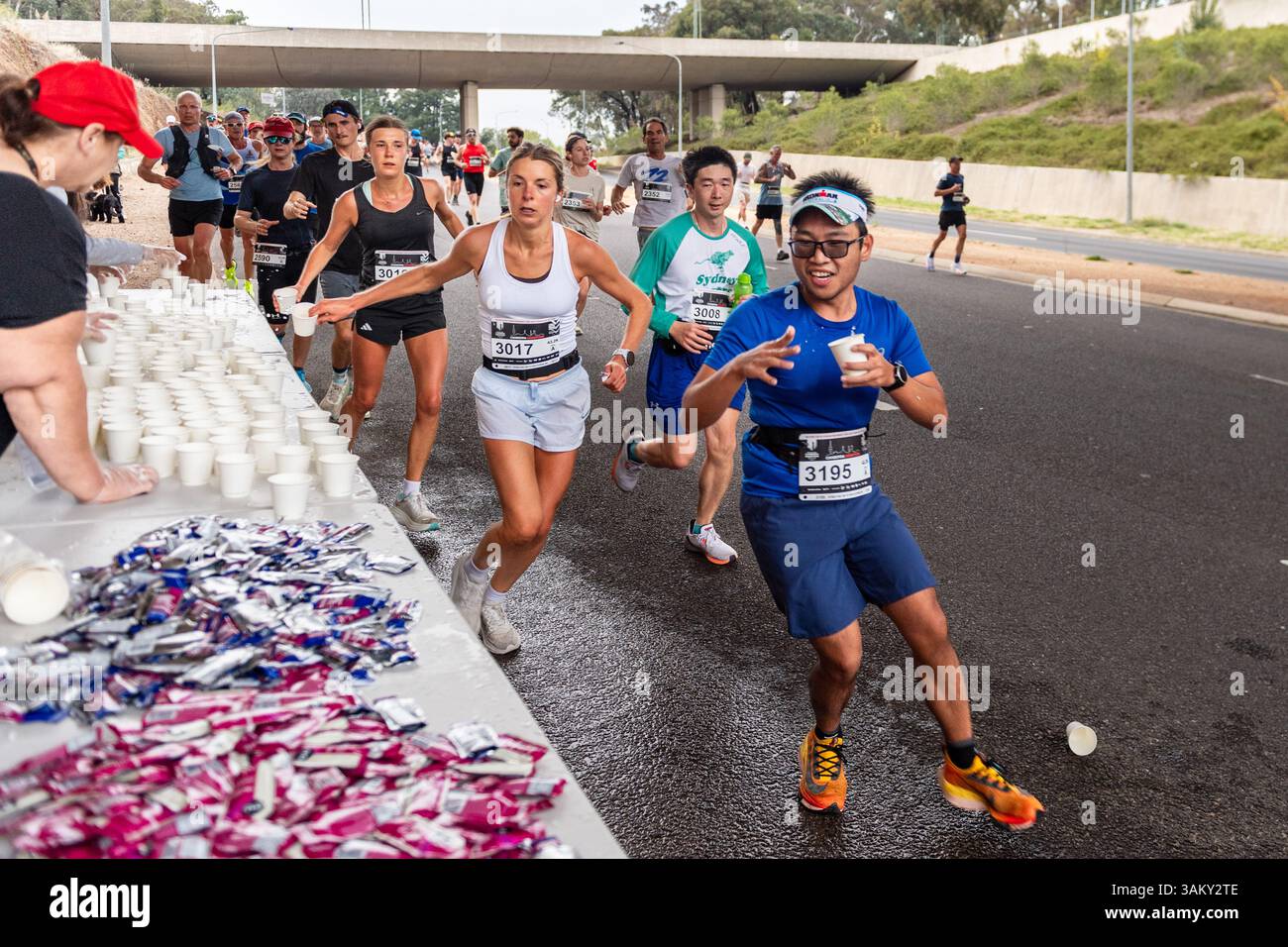 Early race intensity as runners cluster around a hydration station ...
