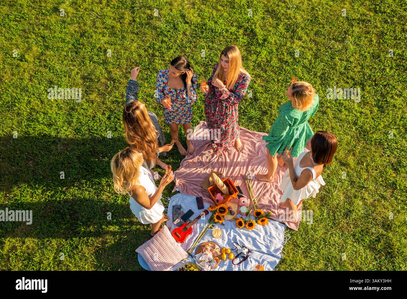 Drone aerial view with a group of women dancing and having fun at a ...