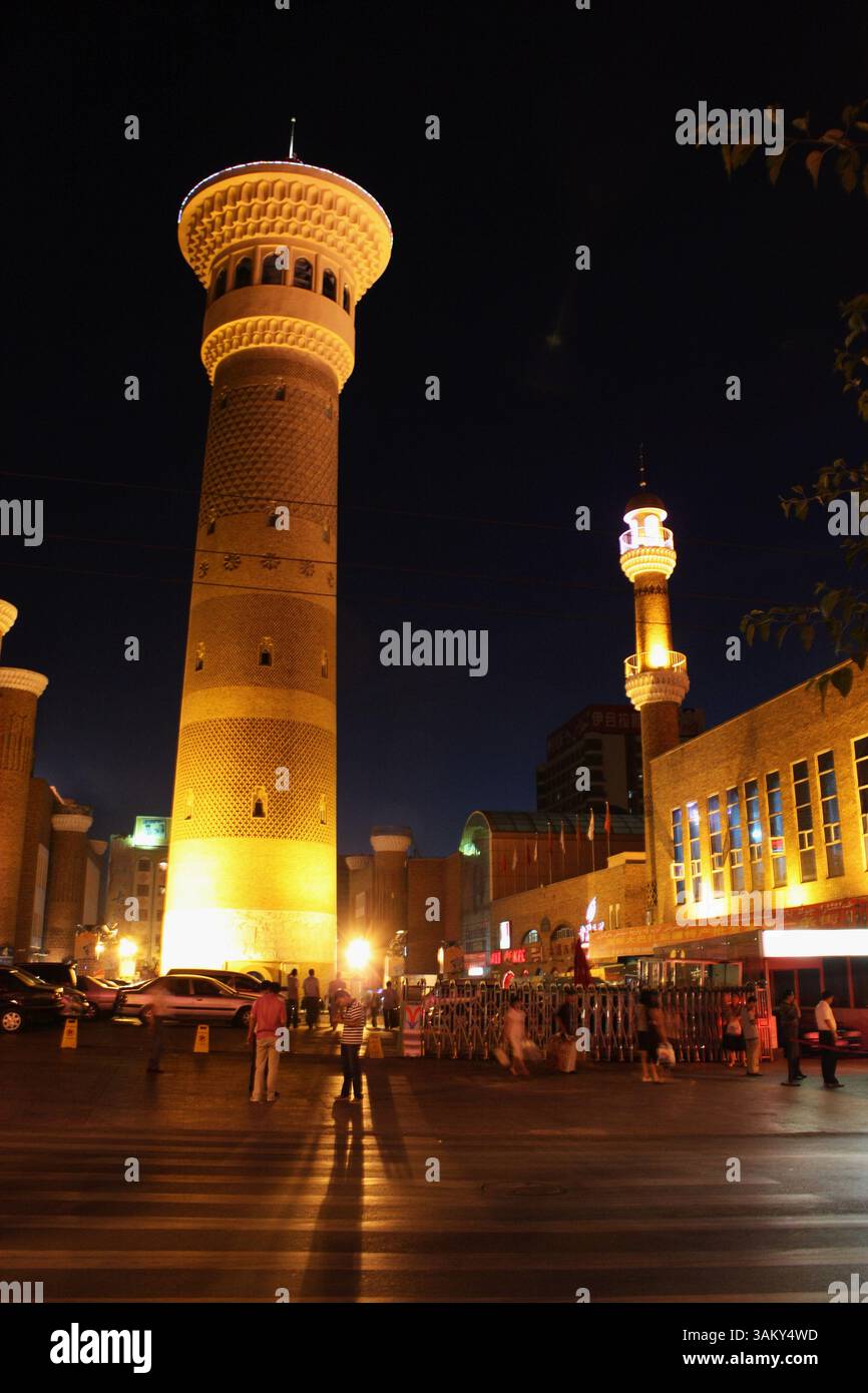 Night View of Urumqi Grand Bazaar – Illuminated Minaret and Bustling ...