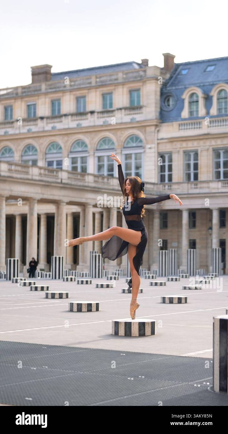 Chic ballet dancer Striking Fashion Pose in Picturesque Paris Courtyard ...