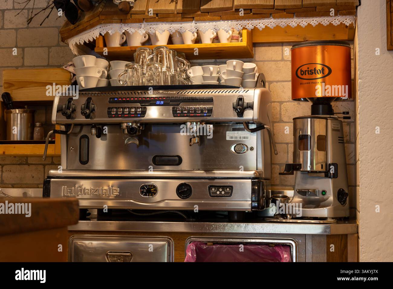 Coffee maker in a slightly dark cafe. Atmospheric picture Stock Photo ...