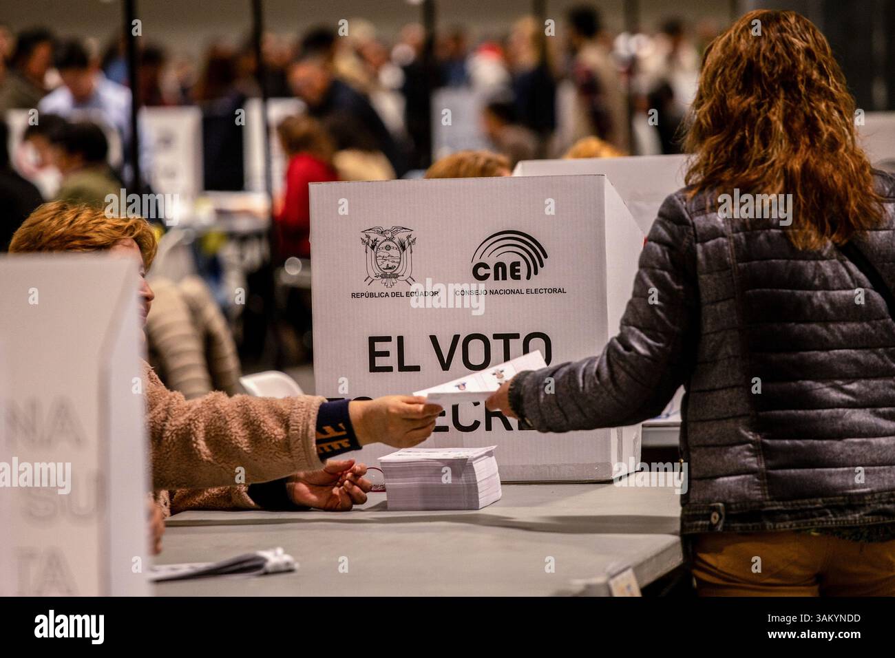 Madrid, Spain. 13th Apr, 2025. An Ecuadorian resident receives a ballot ...