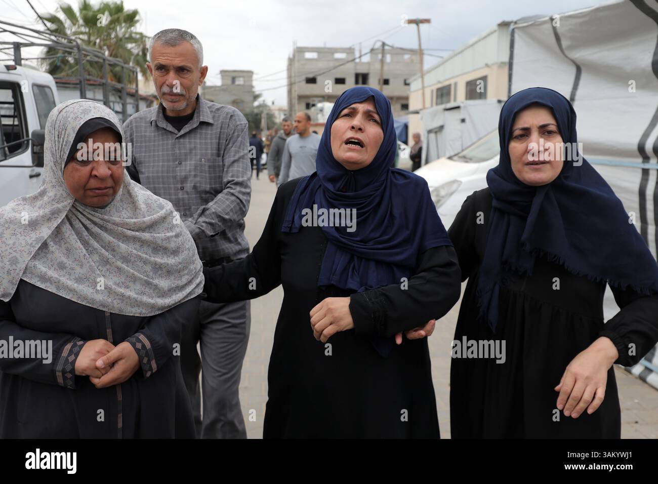 Relatives mourn over the bodies of Abdullah Habbash, along with the ...