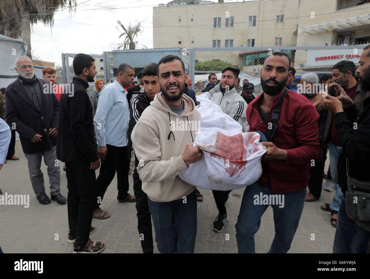Relatives mourn over the bodies of Abdullah Habbash, along with the ...