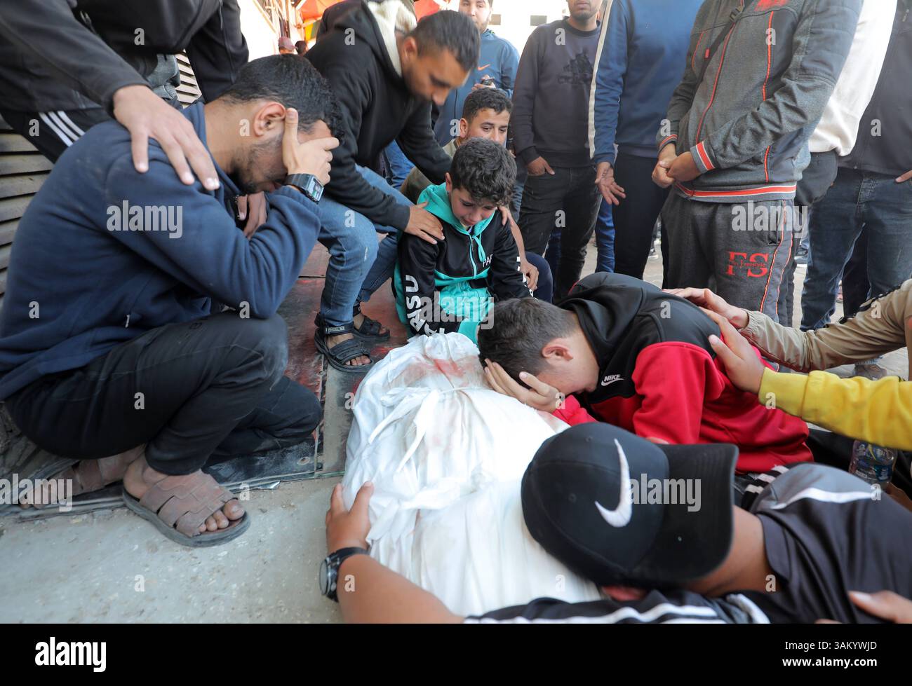 Relatives mourn over the bodies of Abdullah Habbash, along with the ...