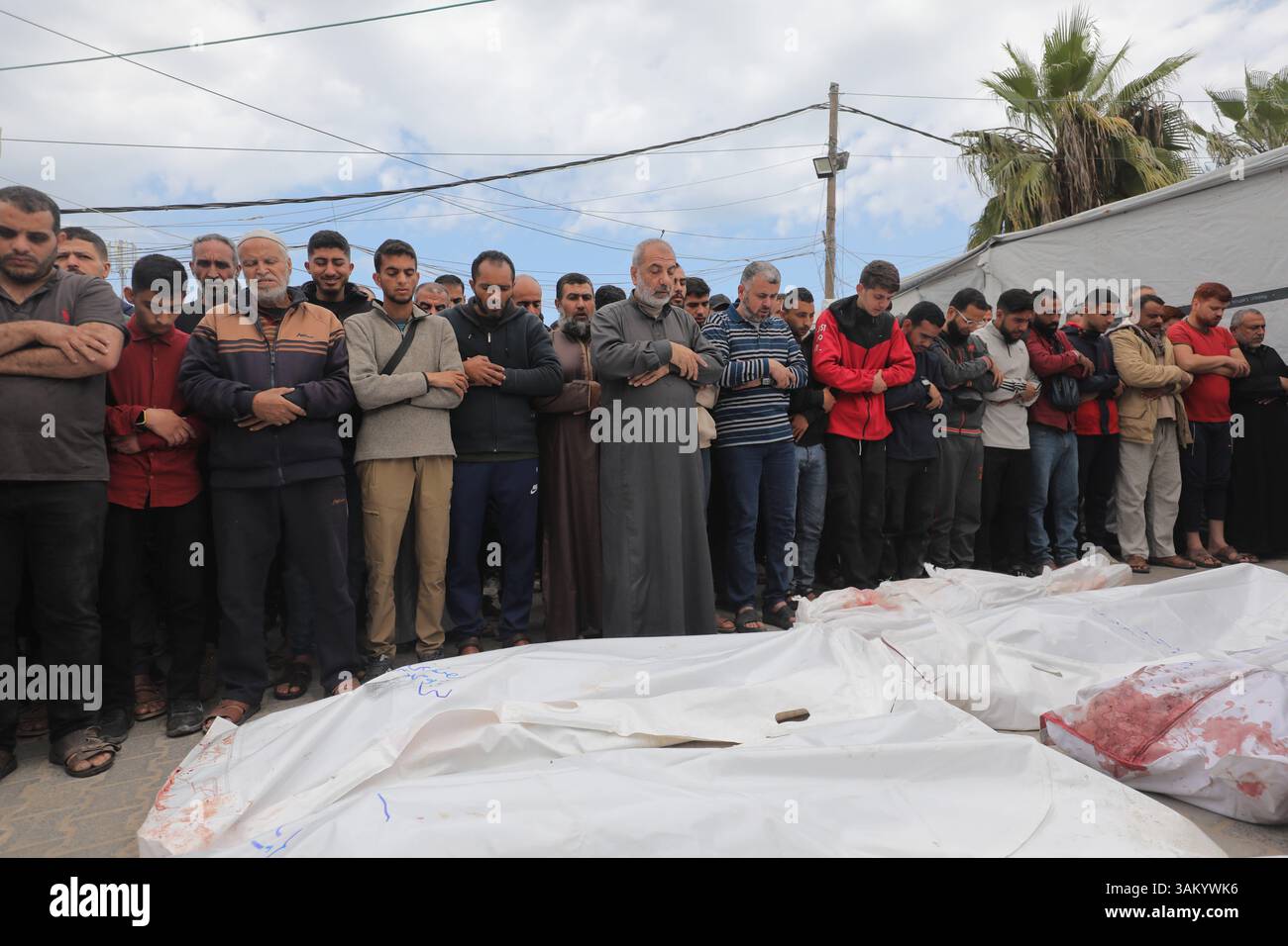 Relatives mourn over the bodies of Abdullah Habbash, along with the ...
