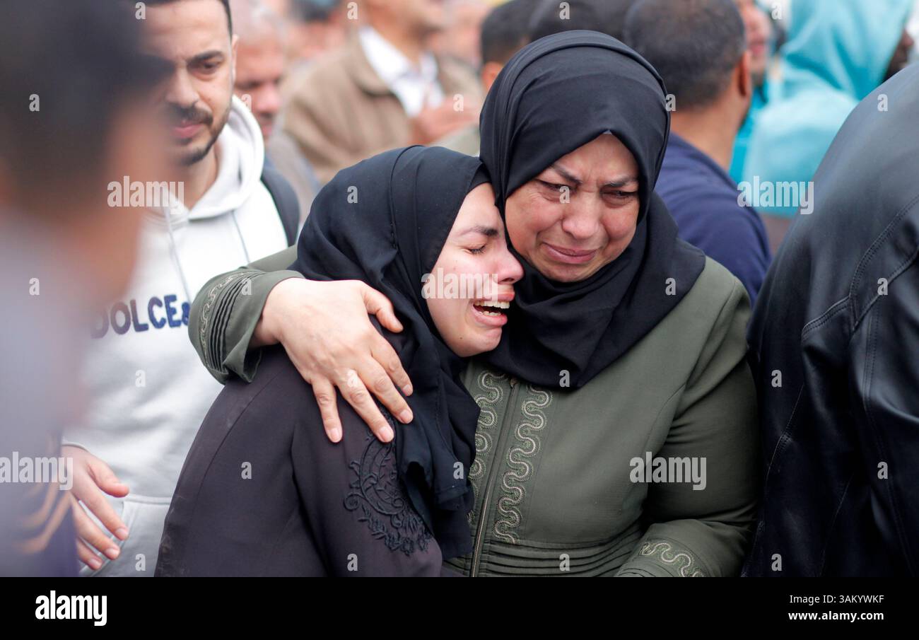 Relatives mourn over the bodies of Abdullah Habbash, along with the ...