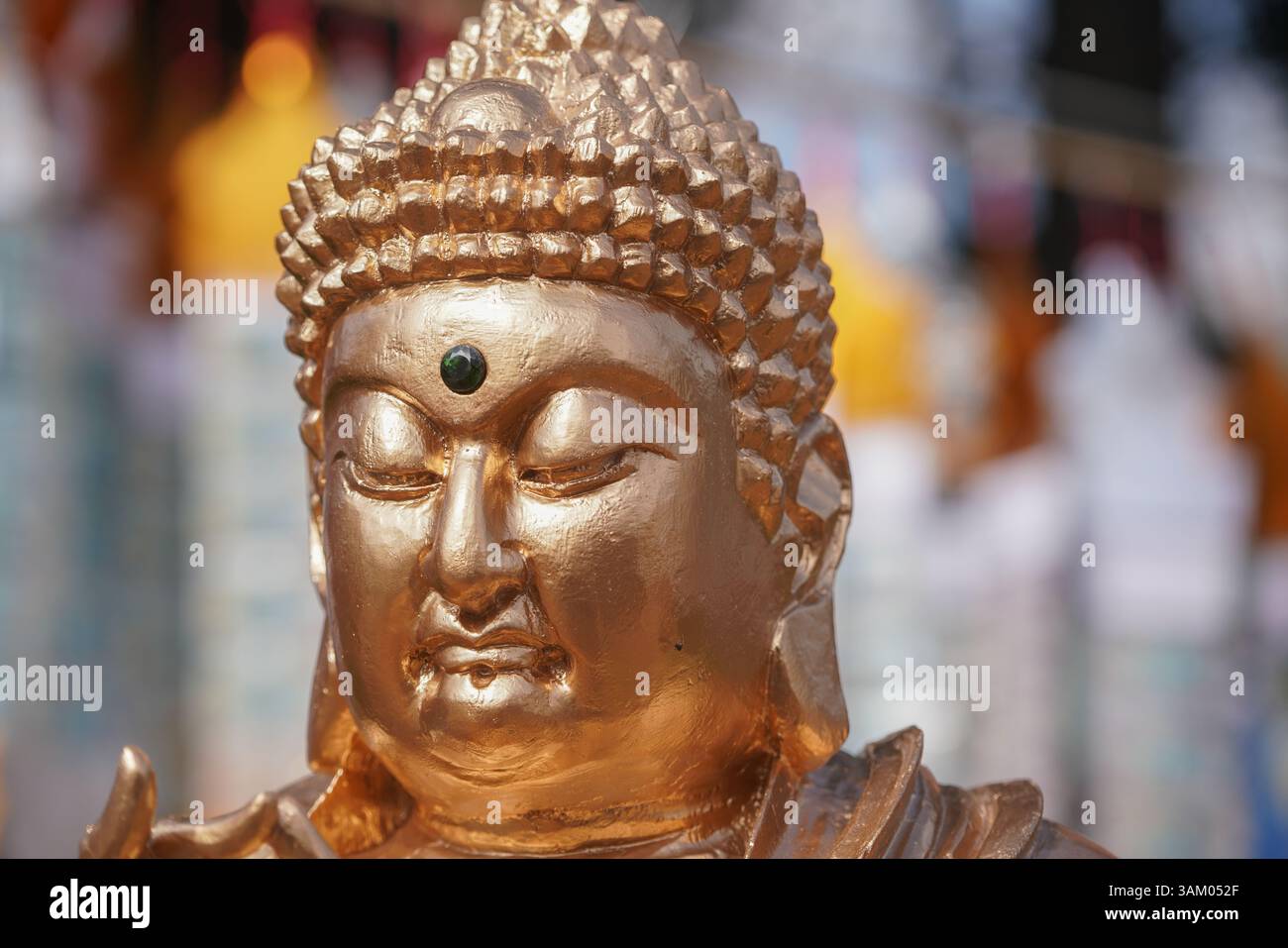 London UK 13 April 2025. A golden Buddha statue at the Thai New Year ...