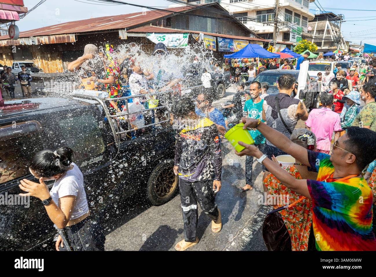 People splash water during the Songkran water festival to celebrate the ...