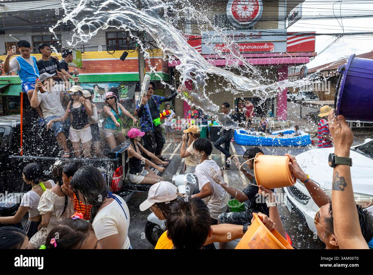 People splash water during the Songkran water festival to celebrate the ...