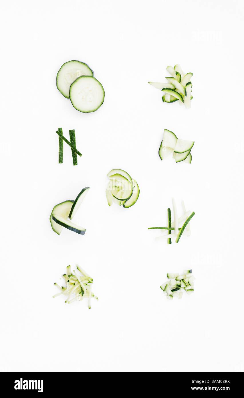 Courgette cut in 9 different ways on white background Stock Photo - Alamy