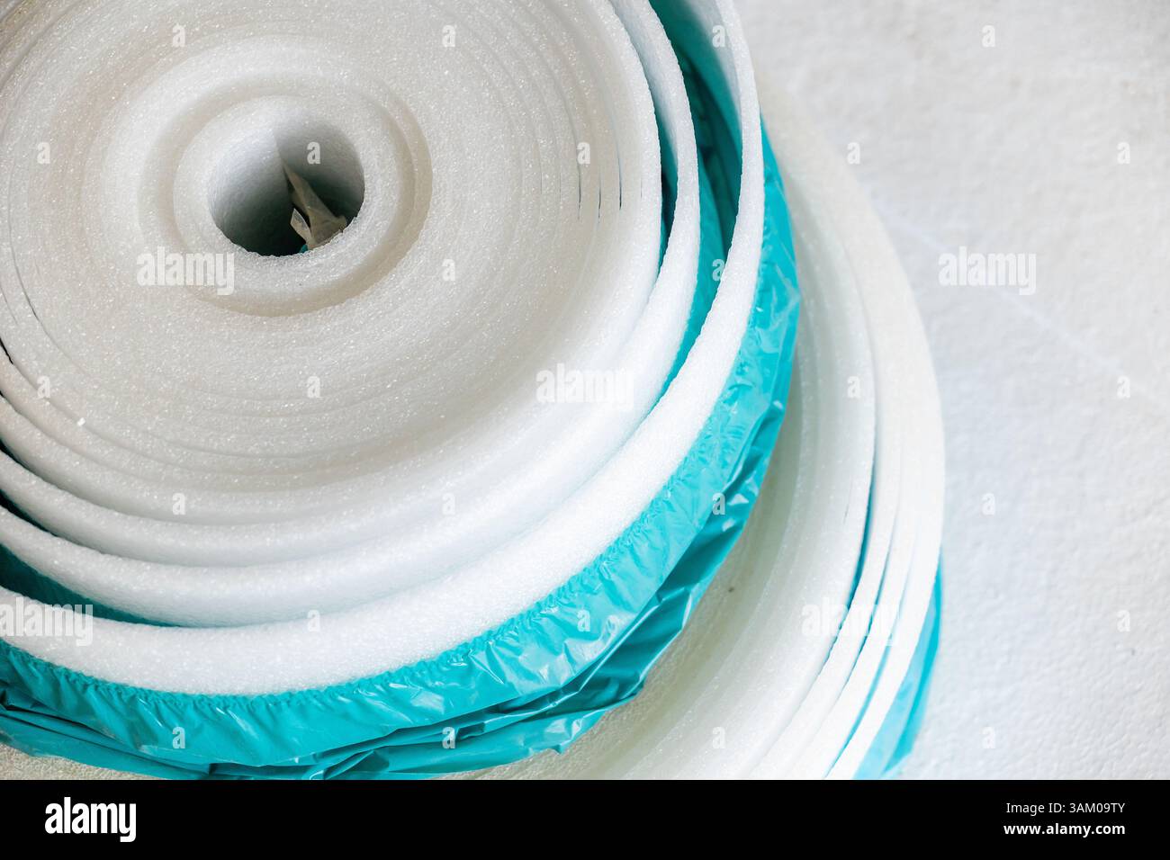 White polyethylene foam roll protecting fragile items during shipping ...