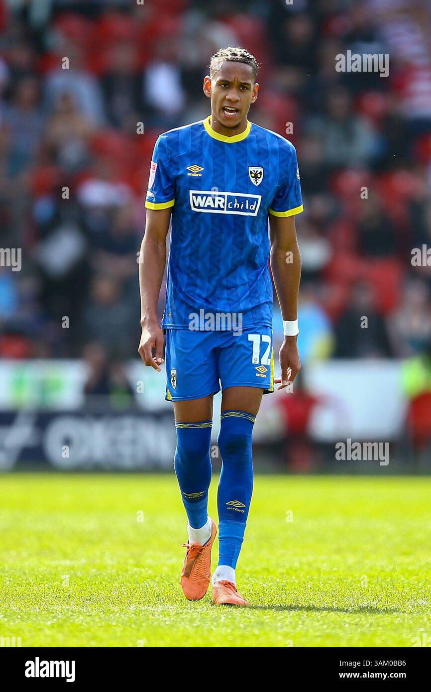 Eco - Power Stadium, Doncaster, England - 12th April 2025 Alistair Smith (12) of AFC Wimbledon ...