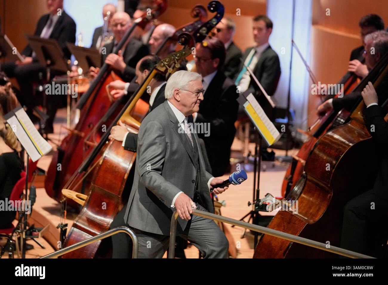 German Federal President Frank-Walter Steinmeier walks beside musicians ...