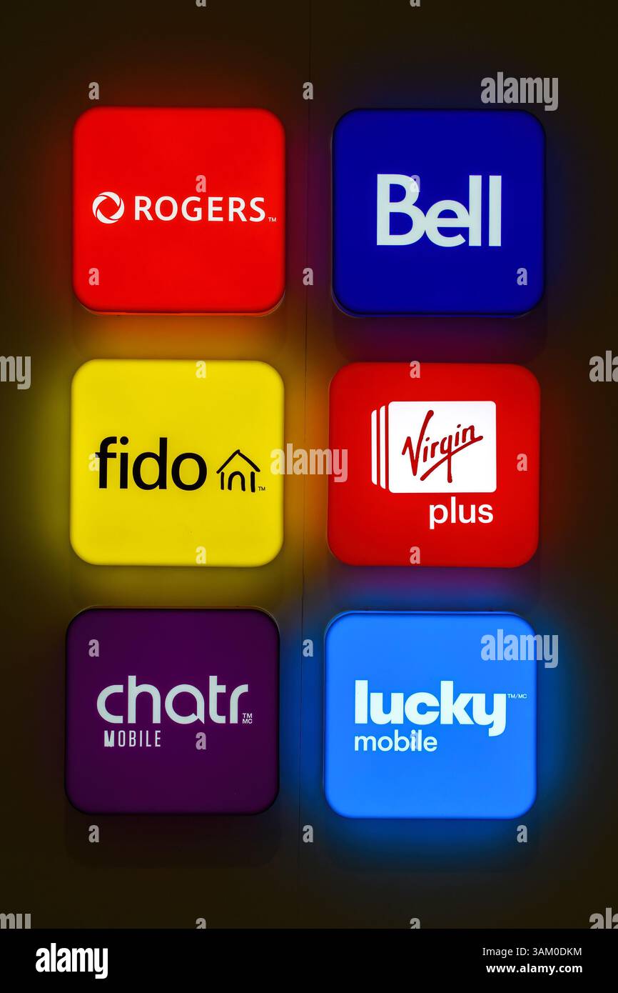 Various logos of telecommunication companies on a store exterior Stock ...