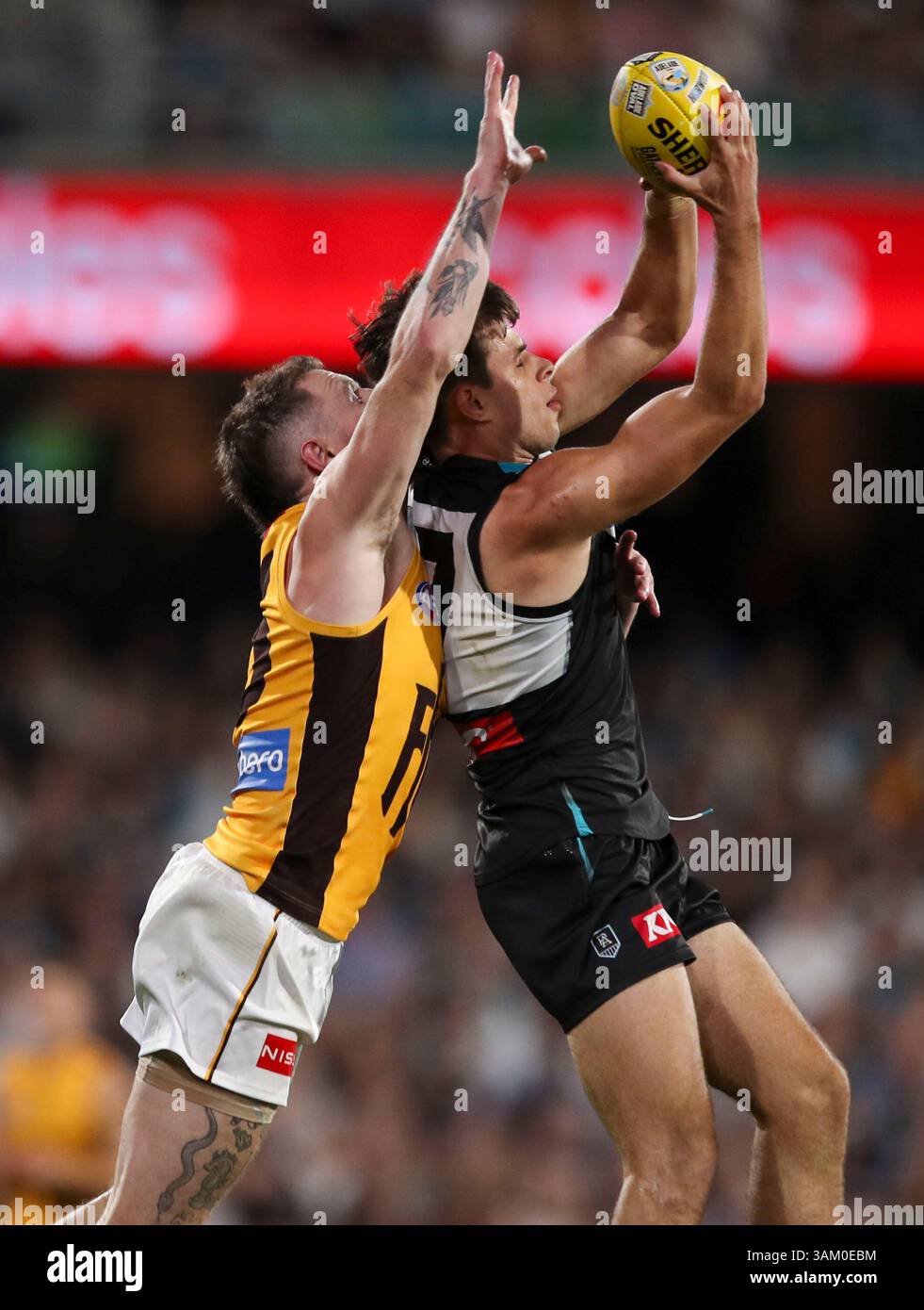 Adelaide, Australia. 13th Apr, 2025. Tom Cochrane of the Power marks ...