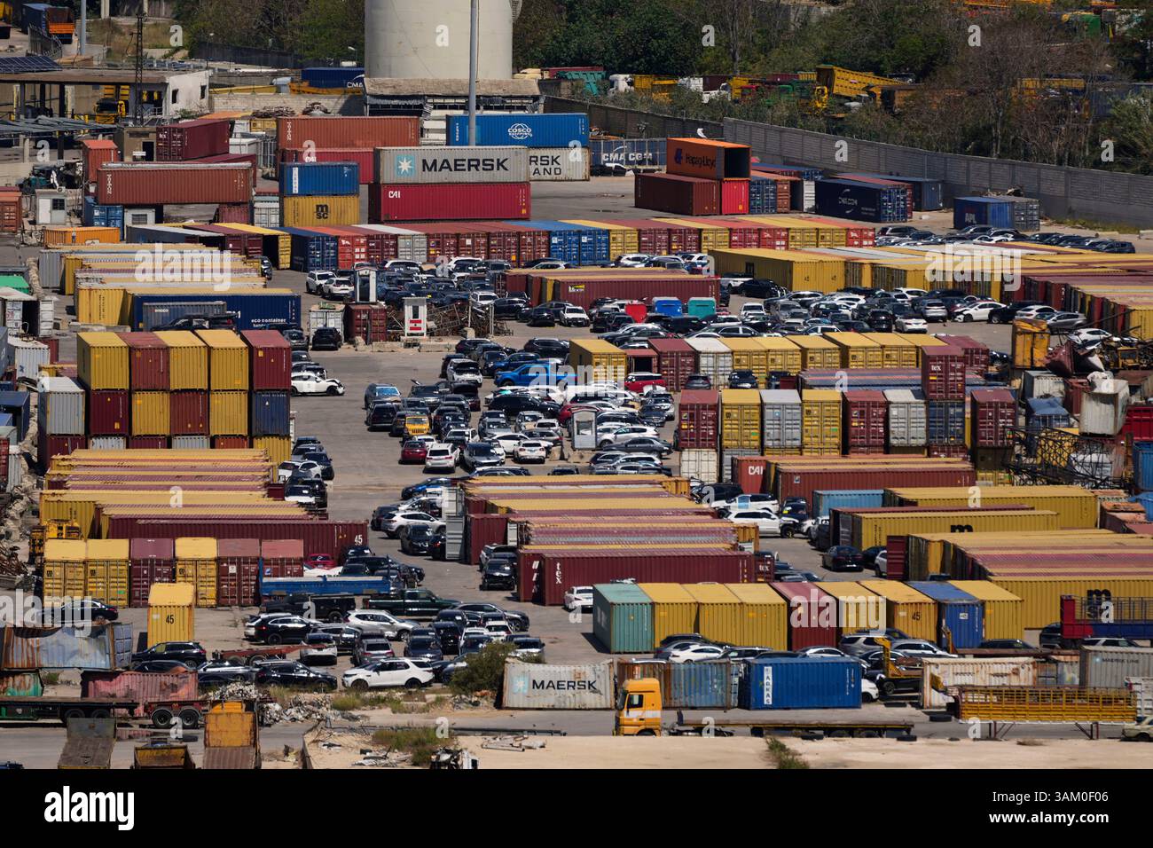 Shipping containers are stacked at the Beirut port, Lebanon, Sunday ...