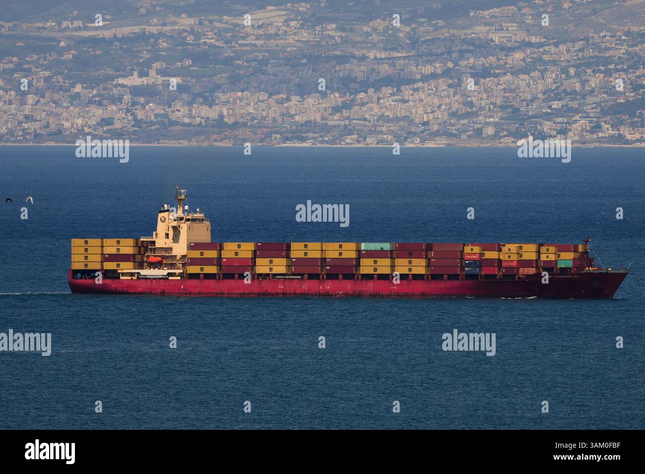 A cargo ship navigates in the Mediterranean Sea along the Beirut ...