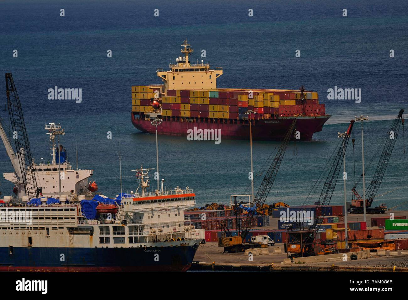 A cargo ship arrives at Beirut port, Lebanon, Sunday, April 13, 2025 ...