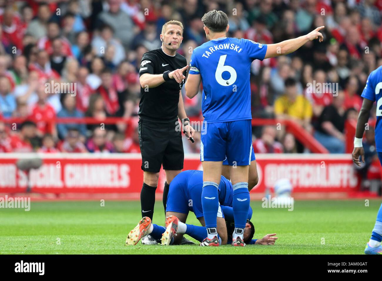 Referee, Craig Pawson has words with James Tarkowski of Everton during ...