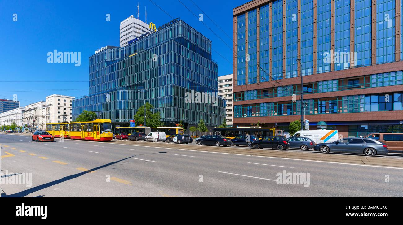 Marszakowska street, Warsaw city center. Private cars and public tram ...