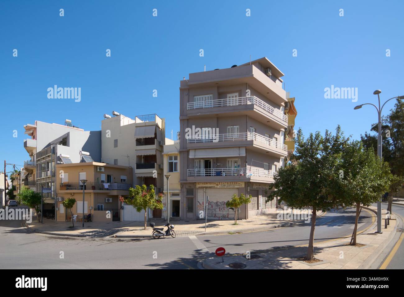 Crete.Greece - april 13, 2025: A quiet urban street in Heraklion lined ...