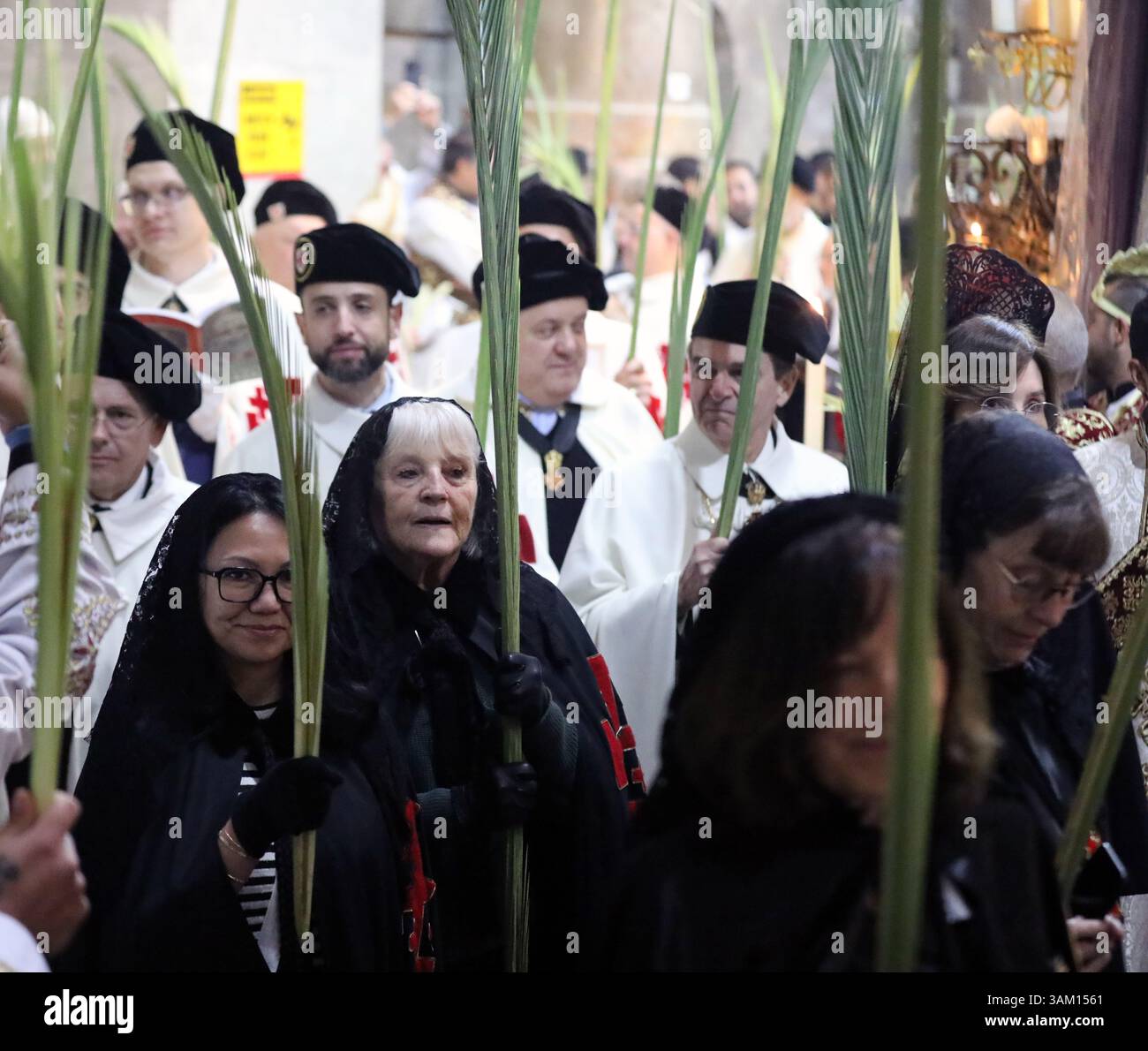 Jerusalem, Israel. 13th Apr, 2025. Monks marching with date palm ...