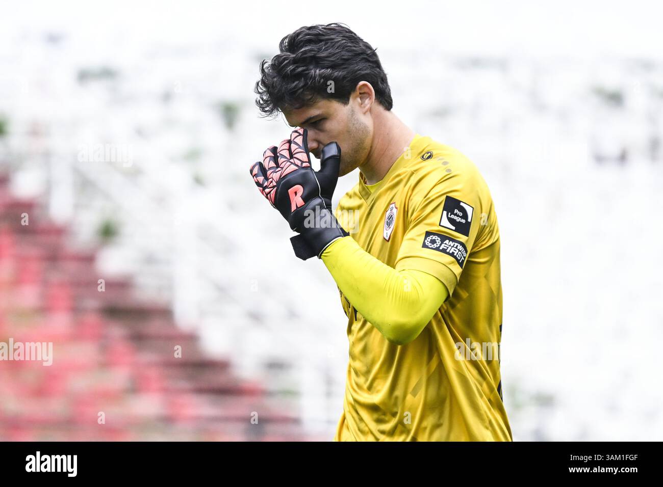 Antwerpen, Belgium. 13th Apr, 2025. Antwerp's goalkeeper Senne Lammens looks dejected during a ...
